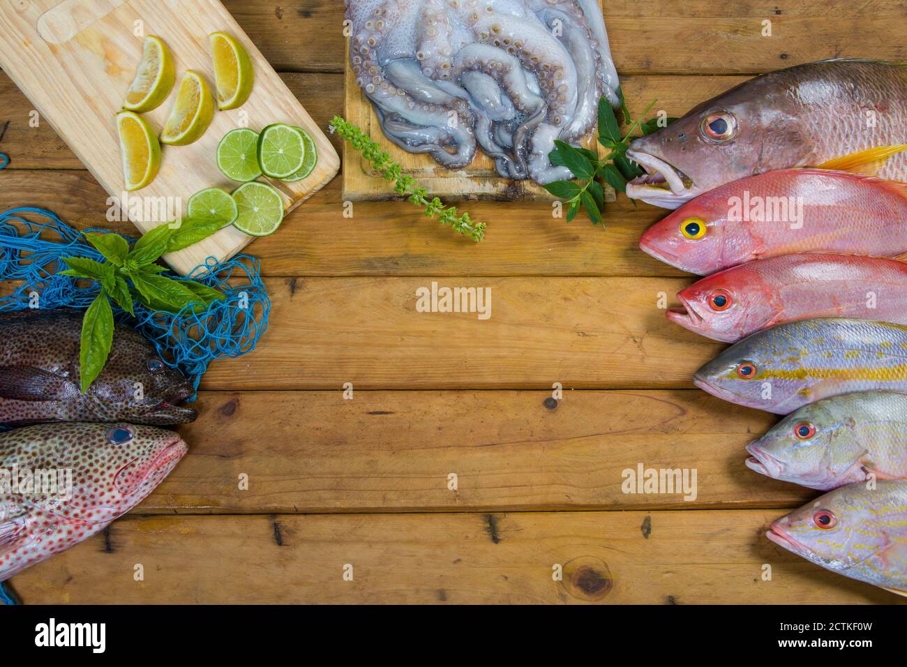 Caribbean Fresh fish seafood on old wooden table. Top view. Close-up ...