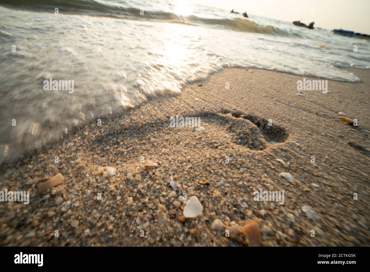 Foot steps on the beach by the sea Stock Photo - Alamy