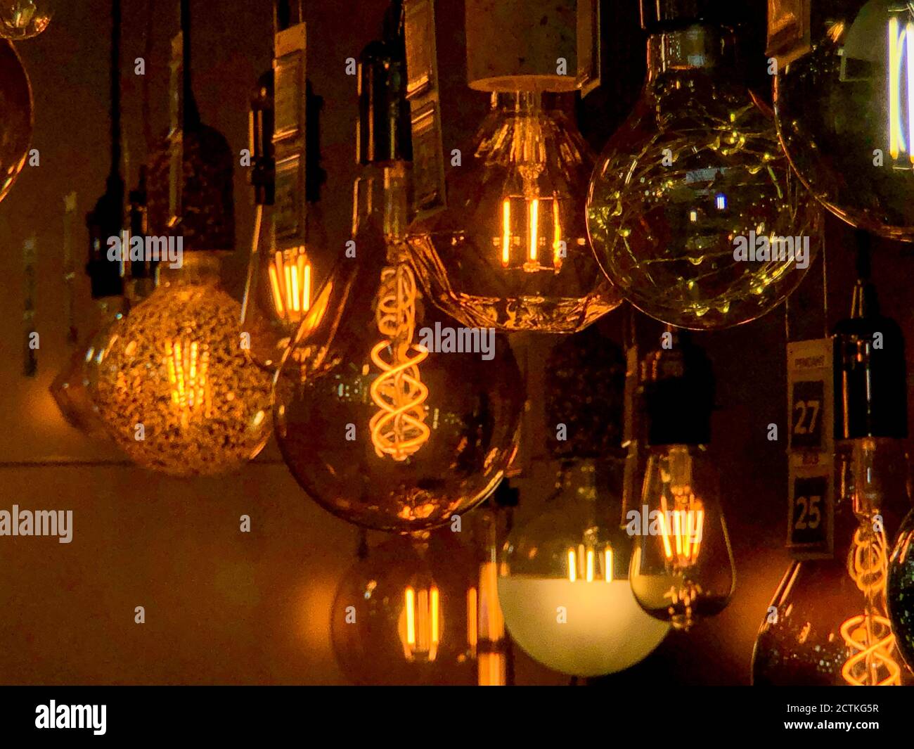 Light bulbs hanging in a showroom Stock Photo - Alamy
