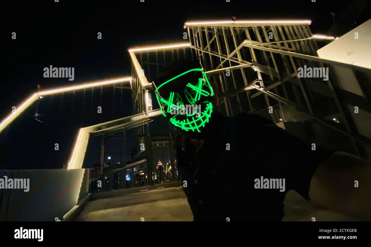 Man wearing neon light hi-res stock photography and images - Alamy