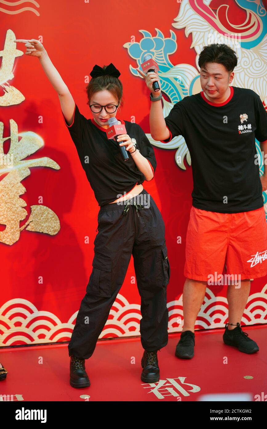 Chinese host and actress Wu Xin, left, shows up at the opening ceremony ...