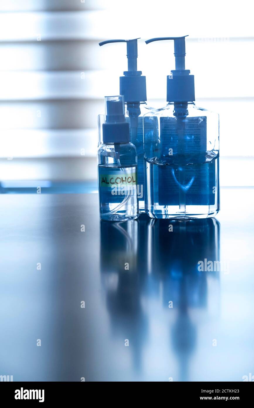 Bottles of Hand sanitizers on over exposed background Stock Photo - Alamy