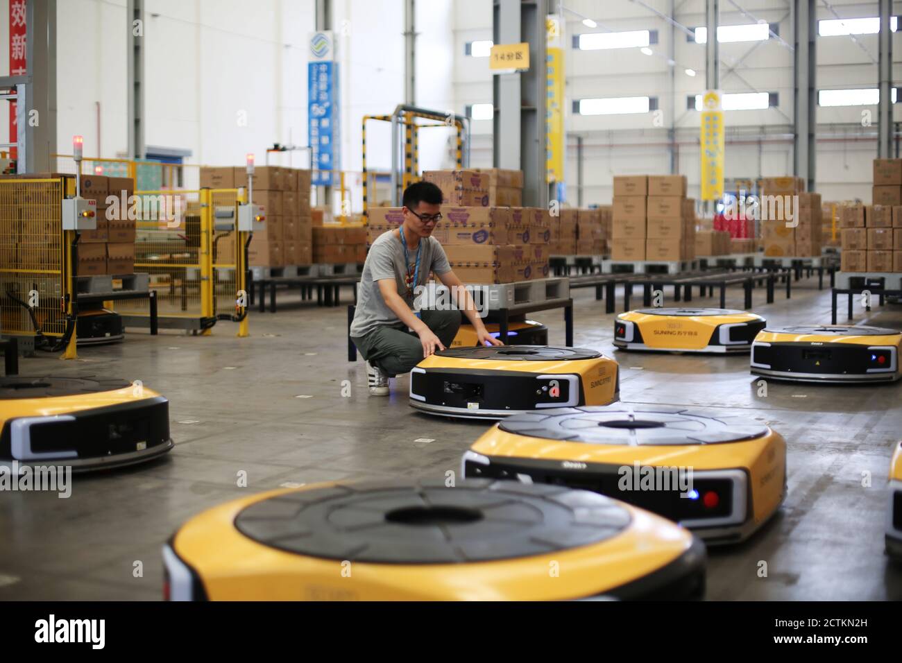 Inside view of robots working at a Suning unmanned 5G storage house in ...