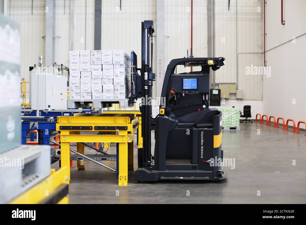 Inside view of robots working at a Suning unmanned 5G storage house in ...
