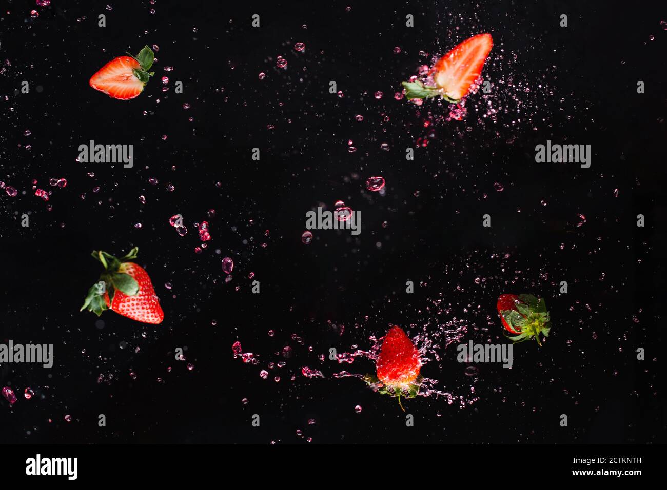 Berry explosion. Strawberry in water splash. Black background Stock ...