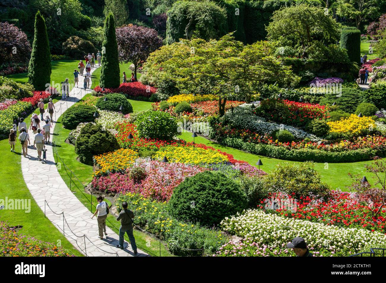 Victoria, BC, Canada. Tourists enjoying the formal flower gardens at ...