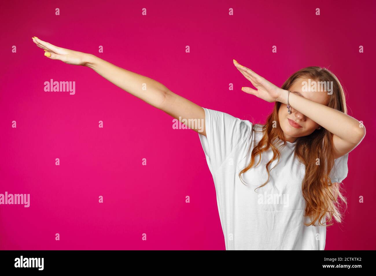 Woman dabbing dance move hi-res stock photography and images - Alamy