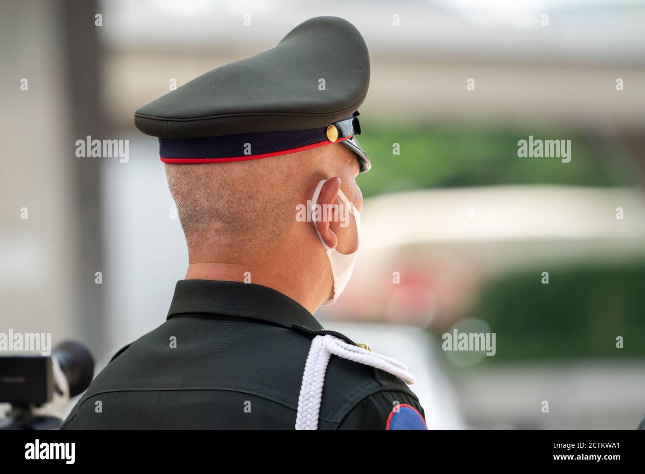 Asian Soldier in backside uniform stands to observation and watch for ...