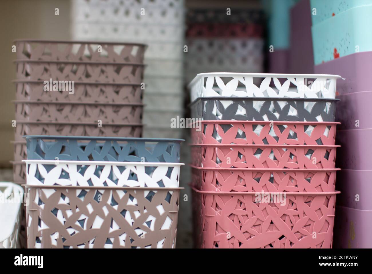 Plastic boxes or storage container. Boxes are stacked on a shelf in the ...