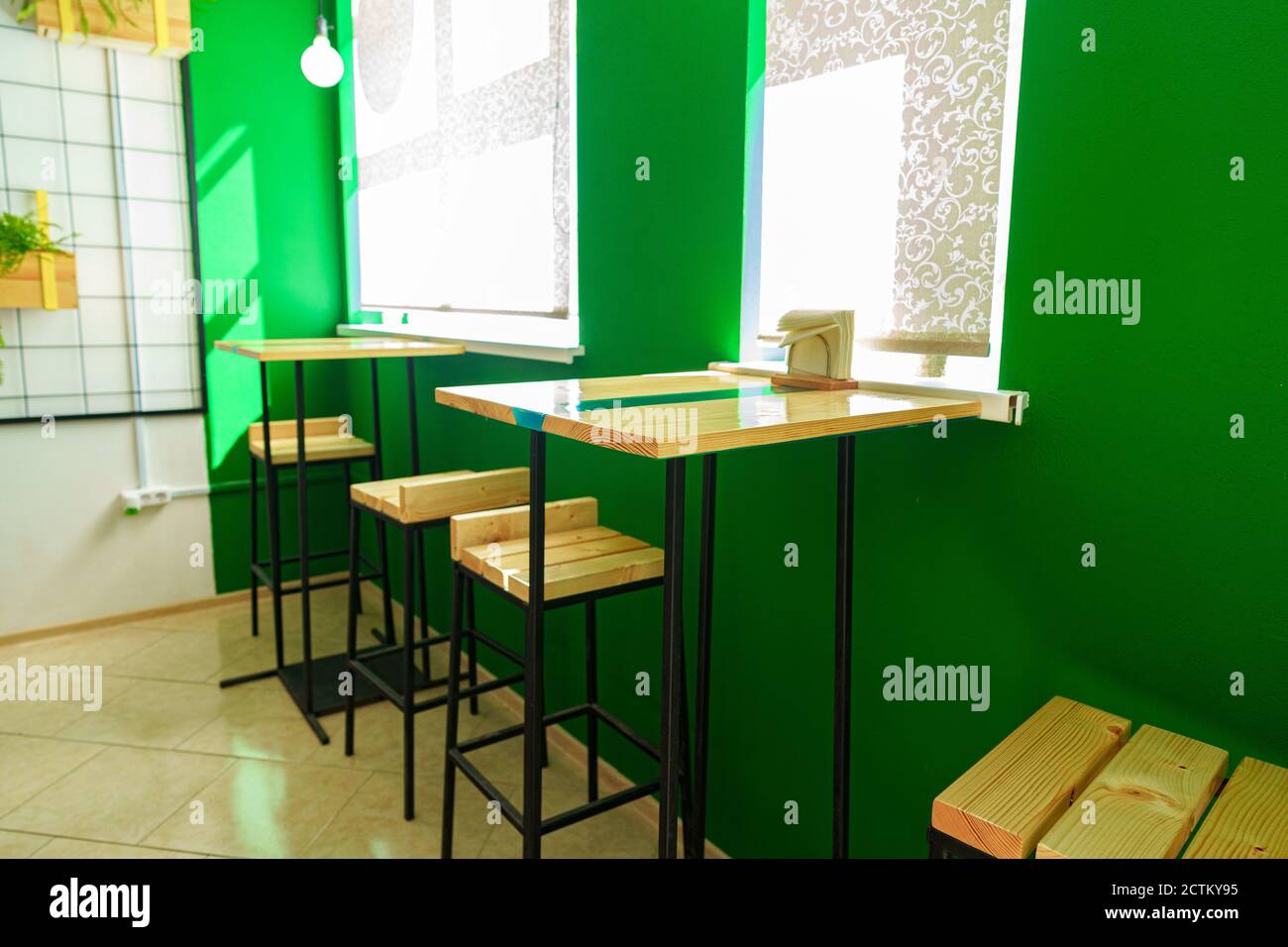 Coffee shop interior background with tables and chairs Stock Photo - Alamy