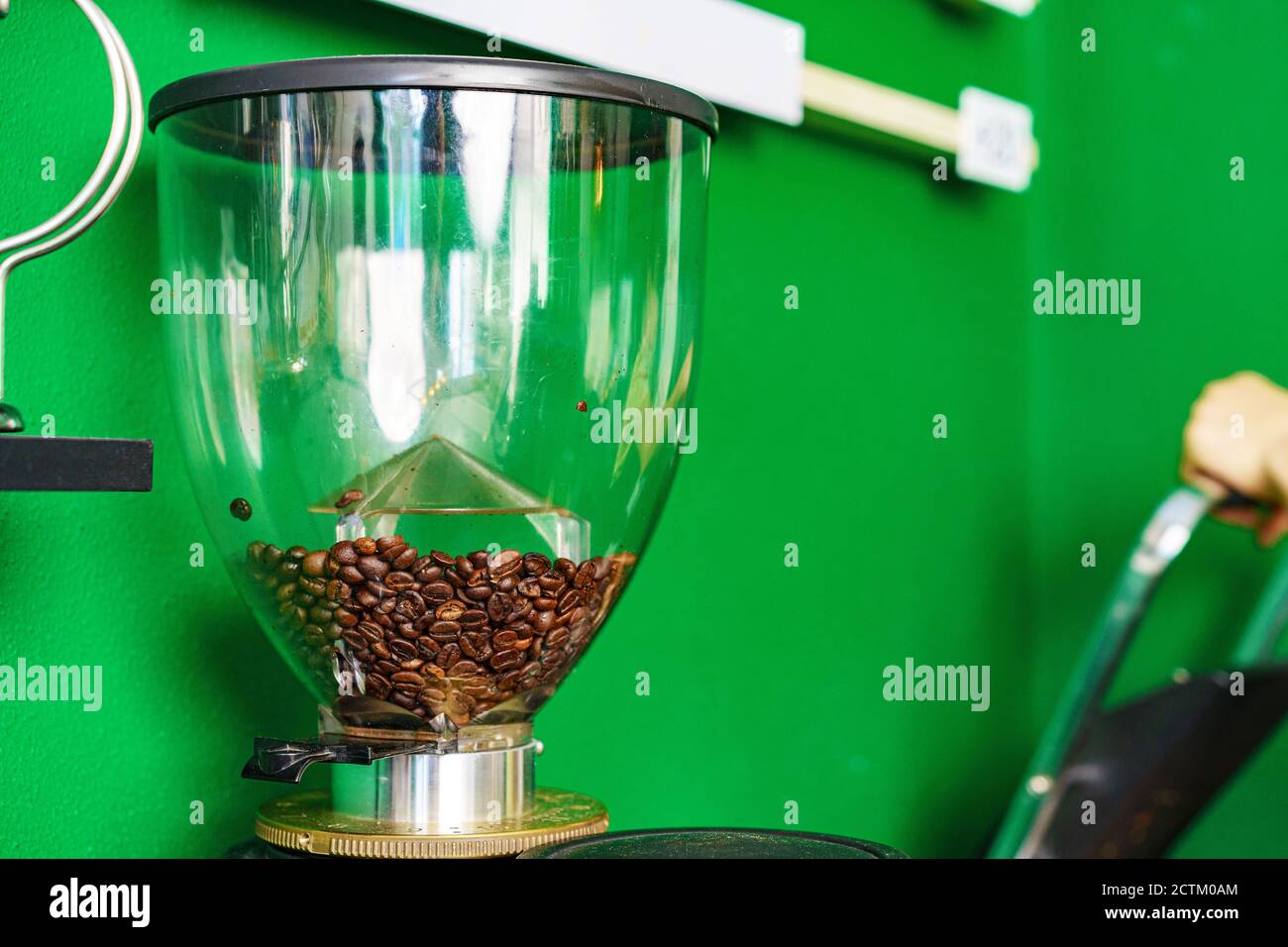Professional coffee grinder machine in coffee shop Stock Photo - Alamy