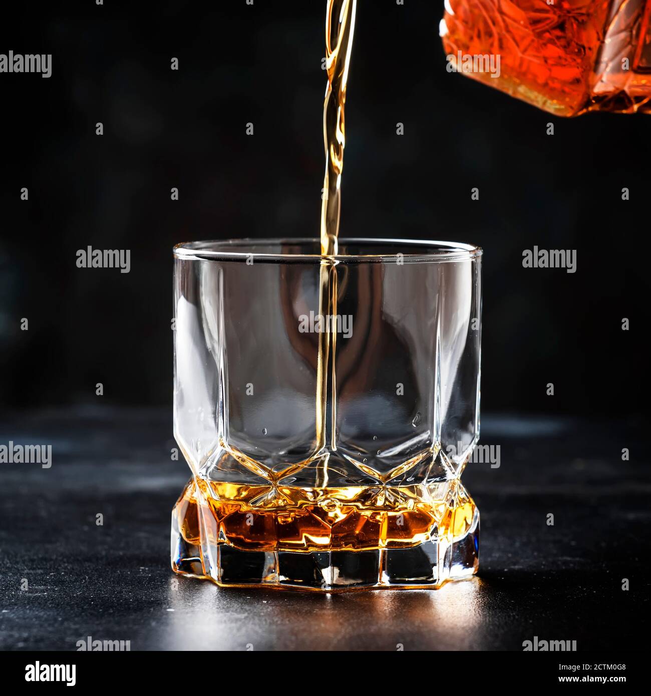 Whiskey Pour In Glass, Dark Background, Selective Focus Stock Photo - Alamy