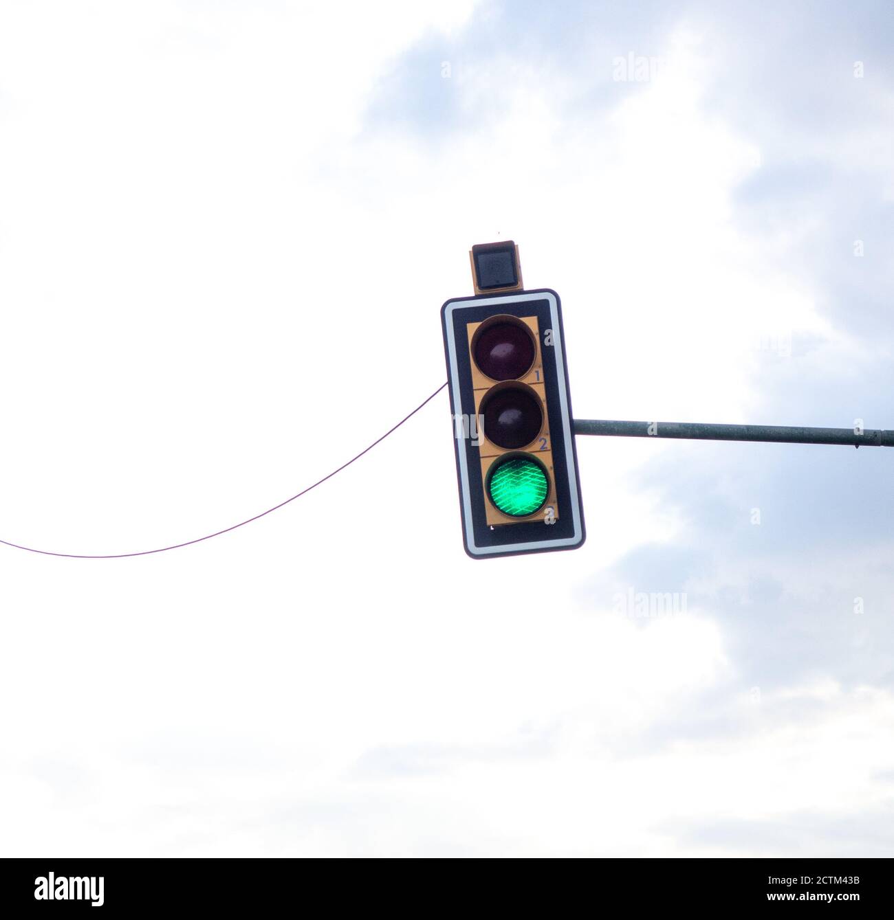 Low angle shot of a green traffic light with sky semaphore Stock Photo ...