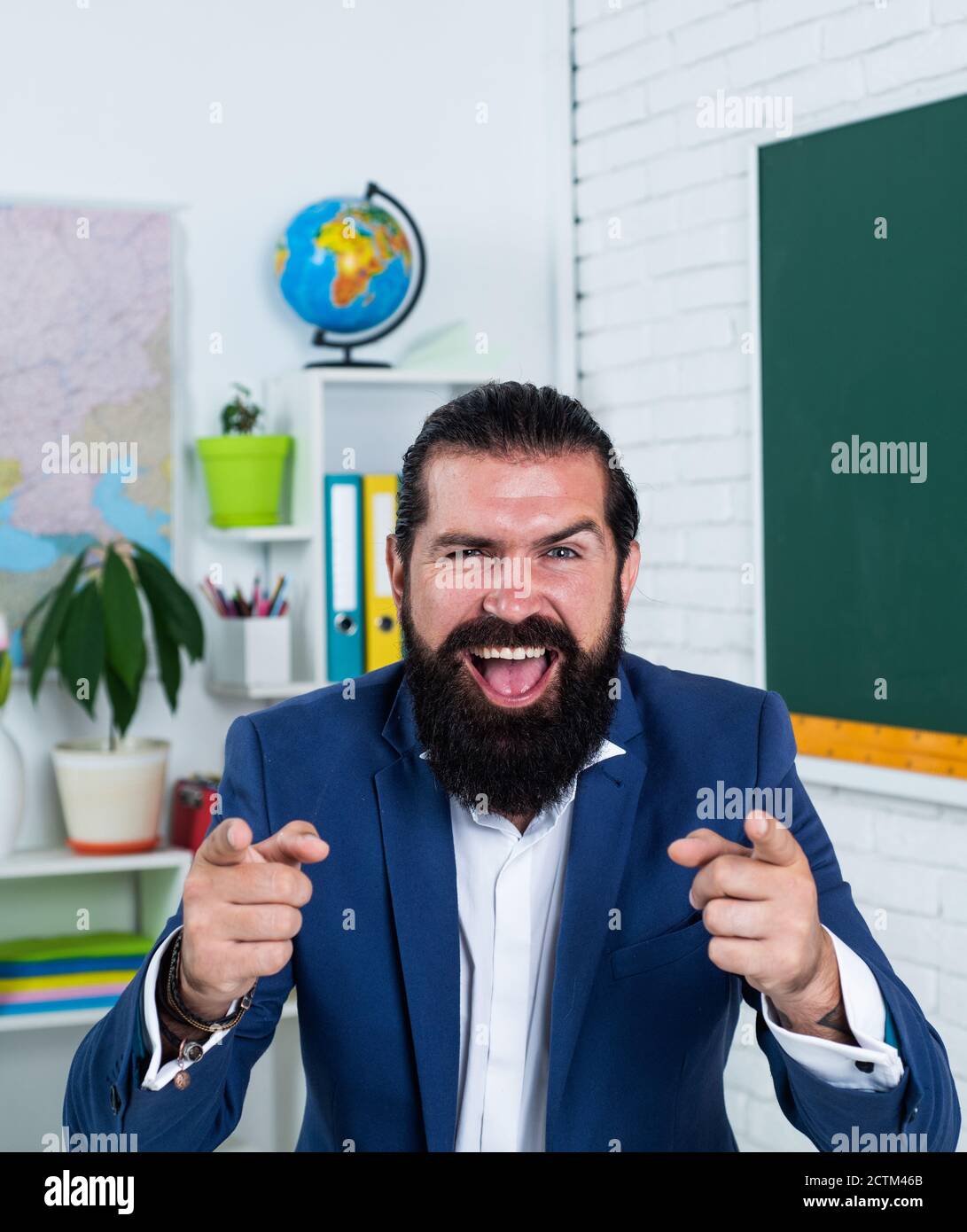 happy and successful teacher man in classroom, school education Stock ...