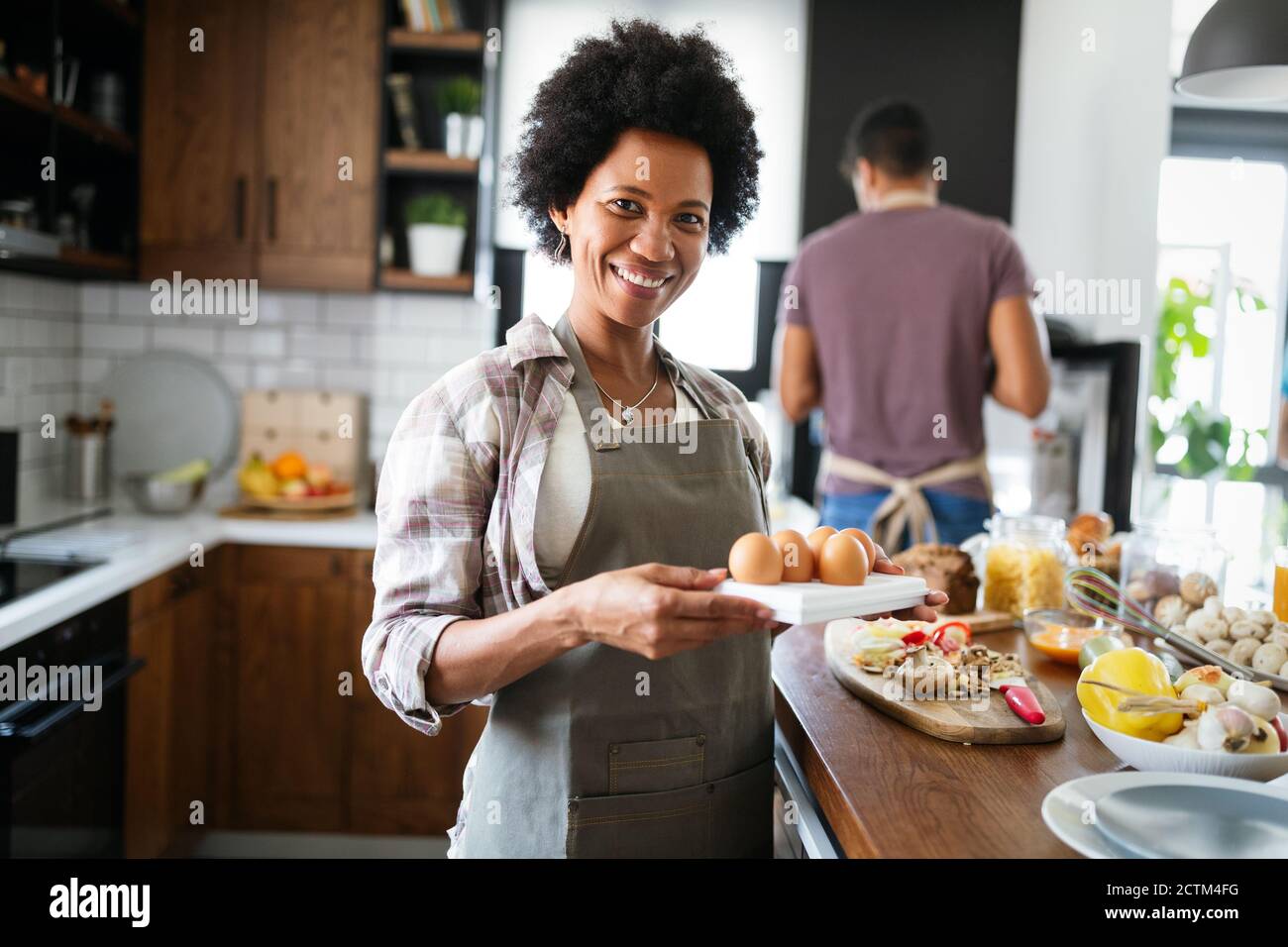Happy black couple cooking and tasting healthy food in kitchen Stock ...