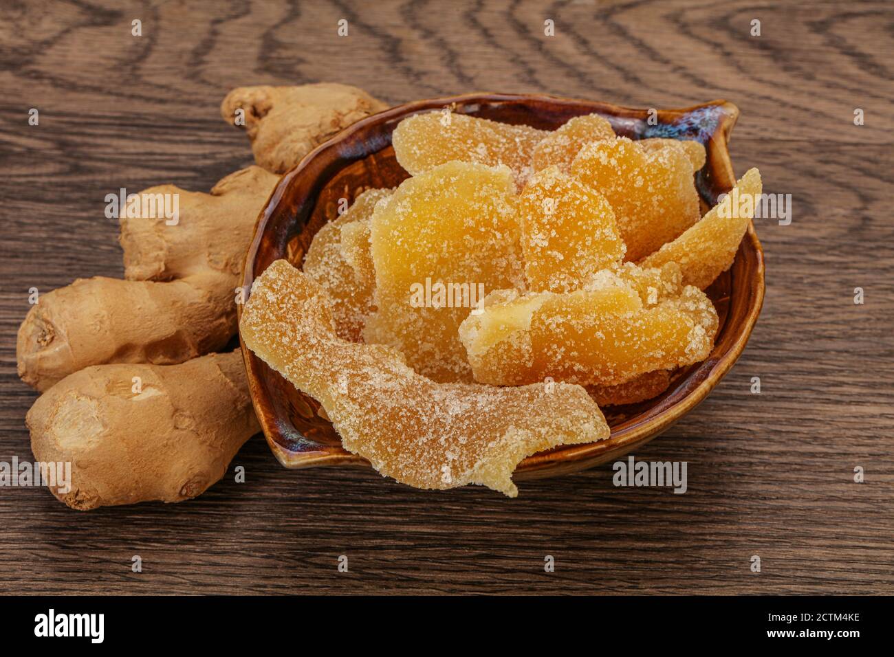 Dry sweet ginger snack in the bowl Stock Photo - Alamy