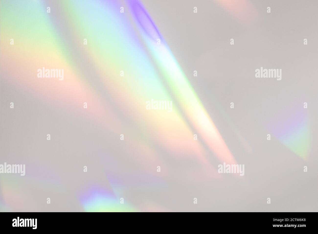 Blurred rainbow light refraction texture on white wall Stock Photo - Alamy