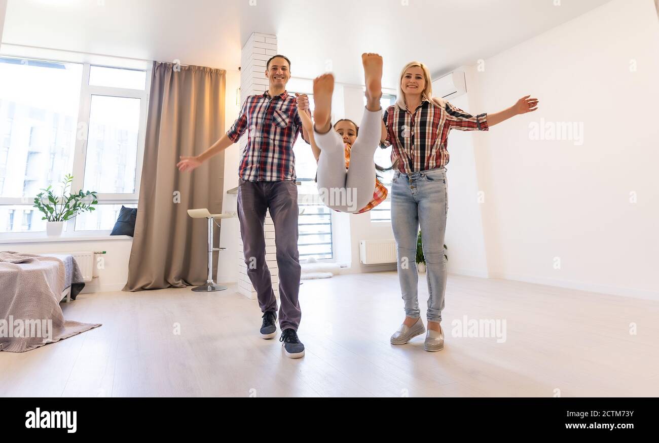 Happy family in new house at moving day Stock Photo - Alamy
