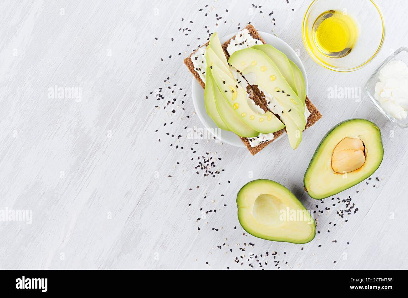 Healthy dietary breakfast of crisps rye flat toast with fresh avocado ...