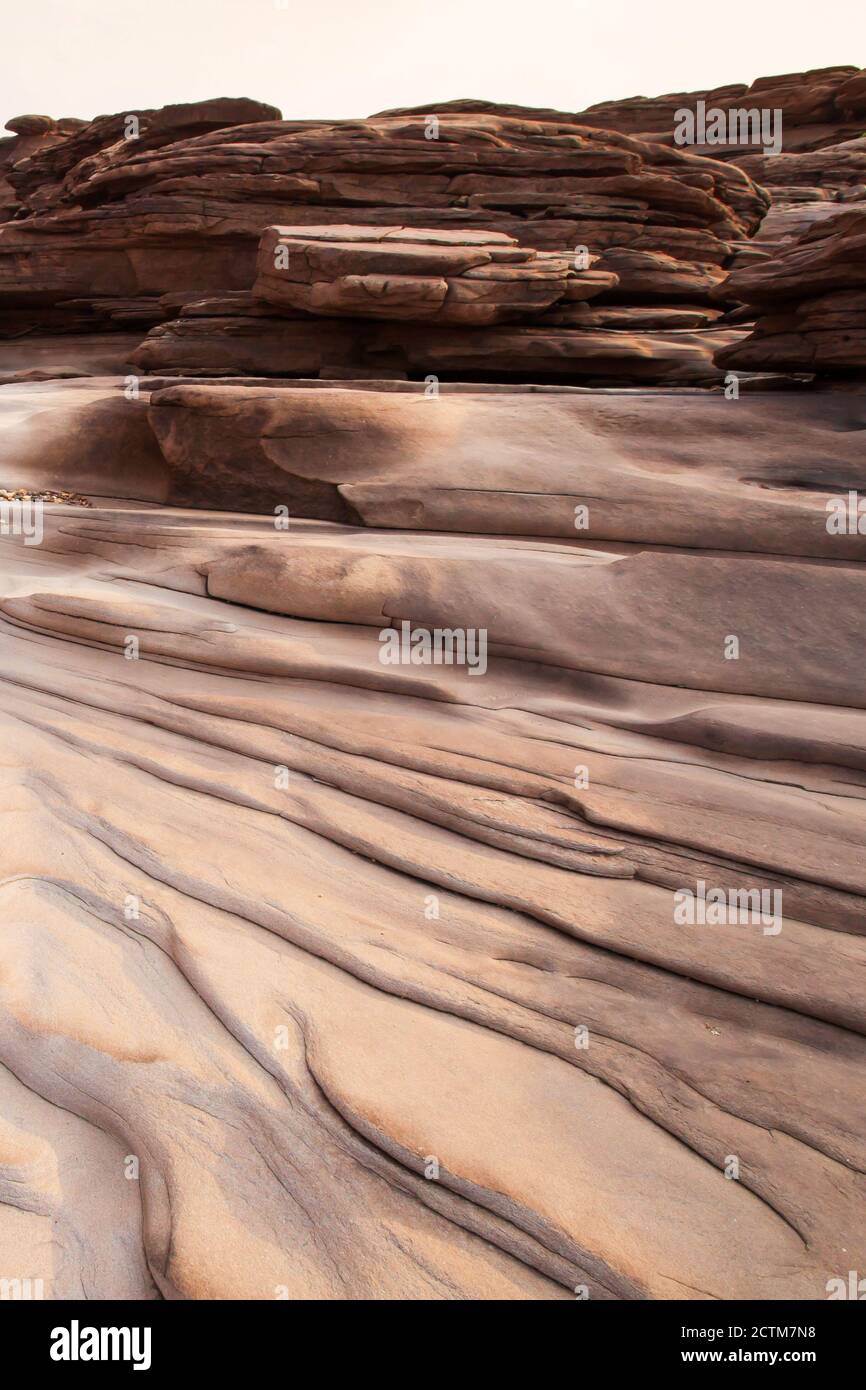 Abstract ripples of steep sedimentary sandstone on Mekong River in ...