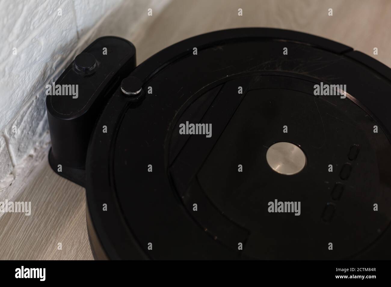 robotic vacuum cleaner charging battery at charging dock Stock Photo ...