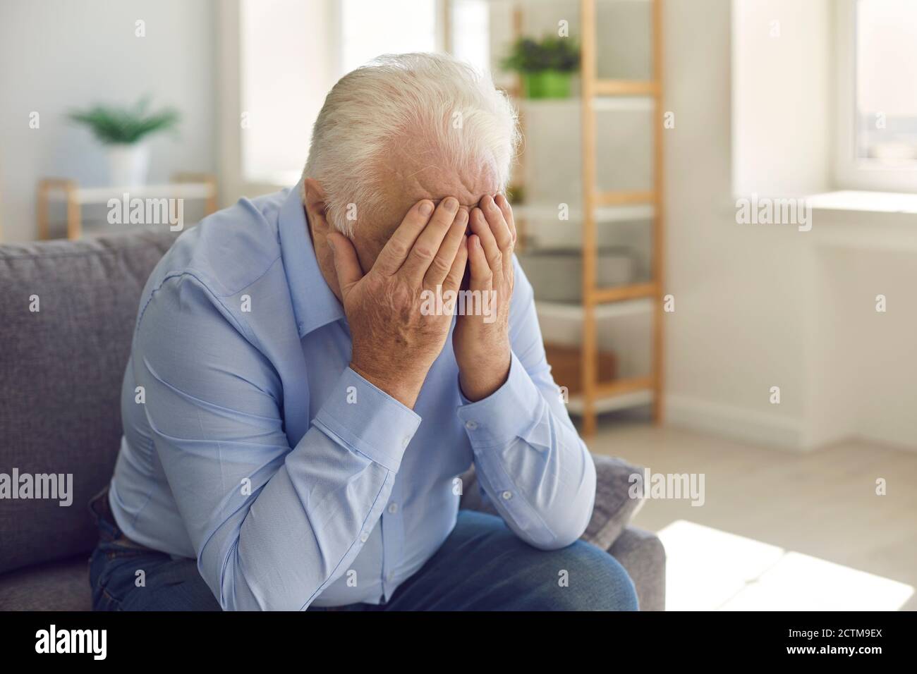 Elderly man, grieving about death of relative or forgotten by family ...