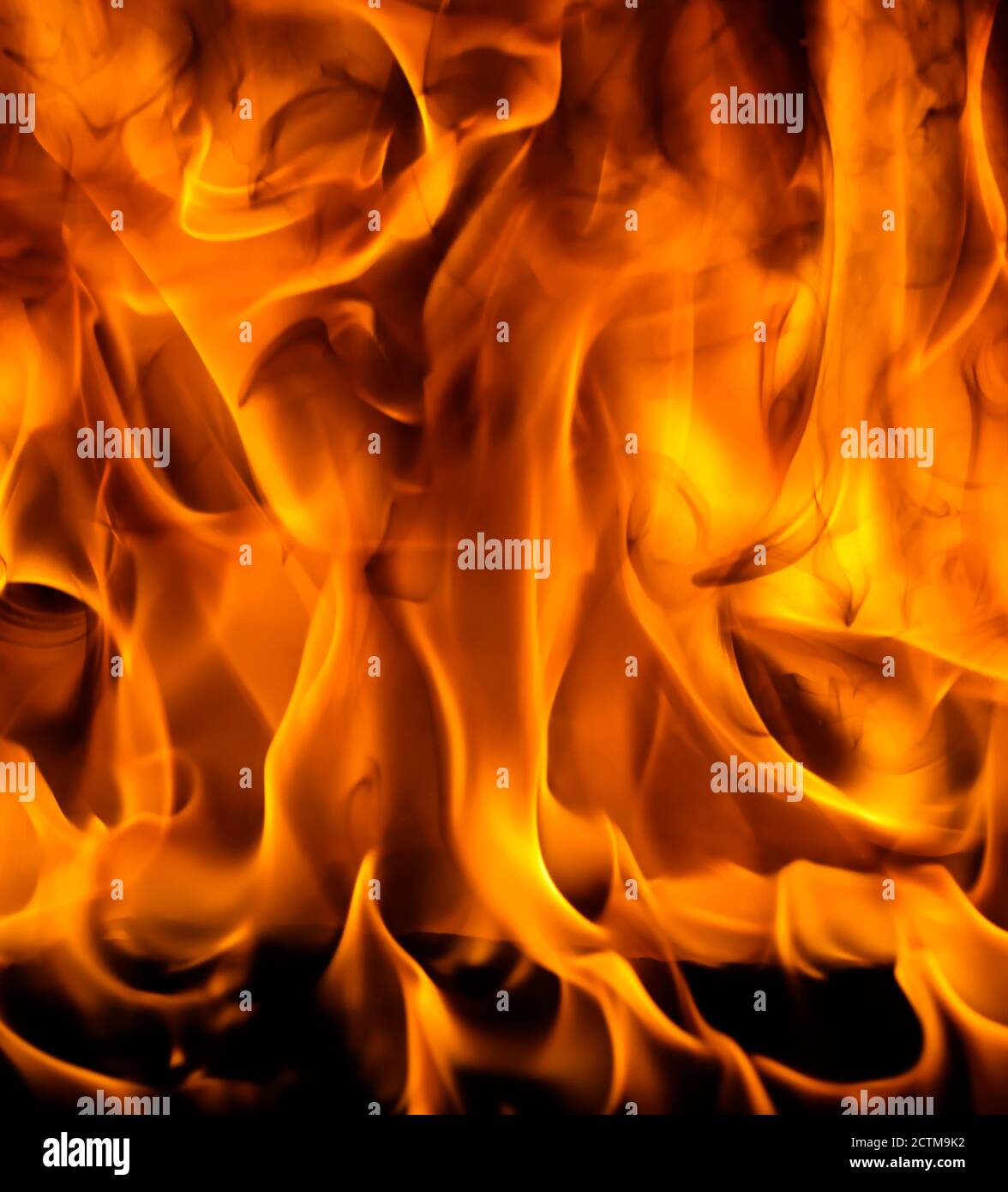Red blaze Fire flame on a black background Stock Photo - Alamy