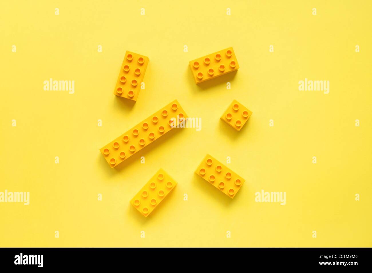 Childrens building blocks similar to legos, yellow blocks on yellow ...