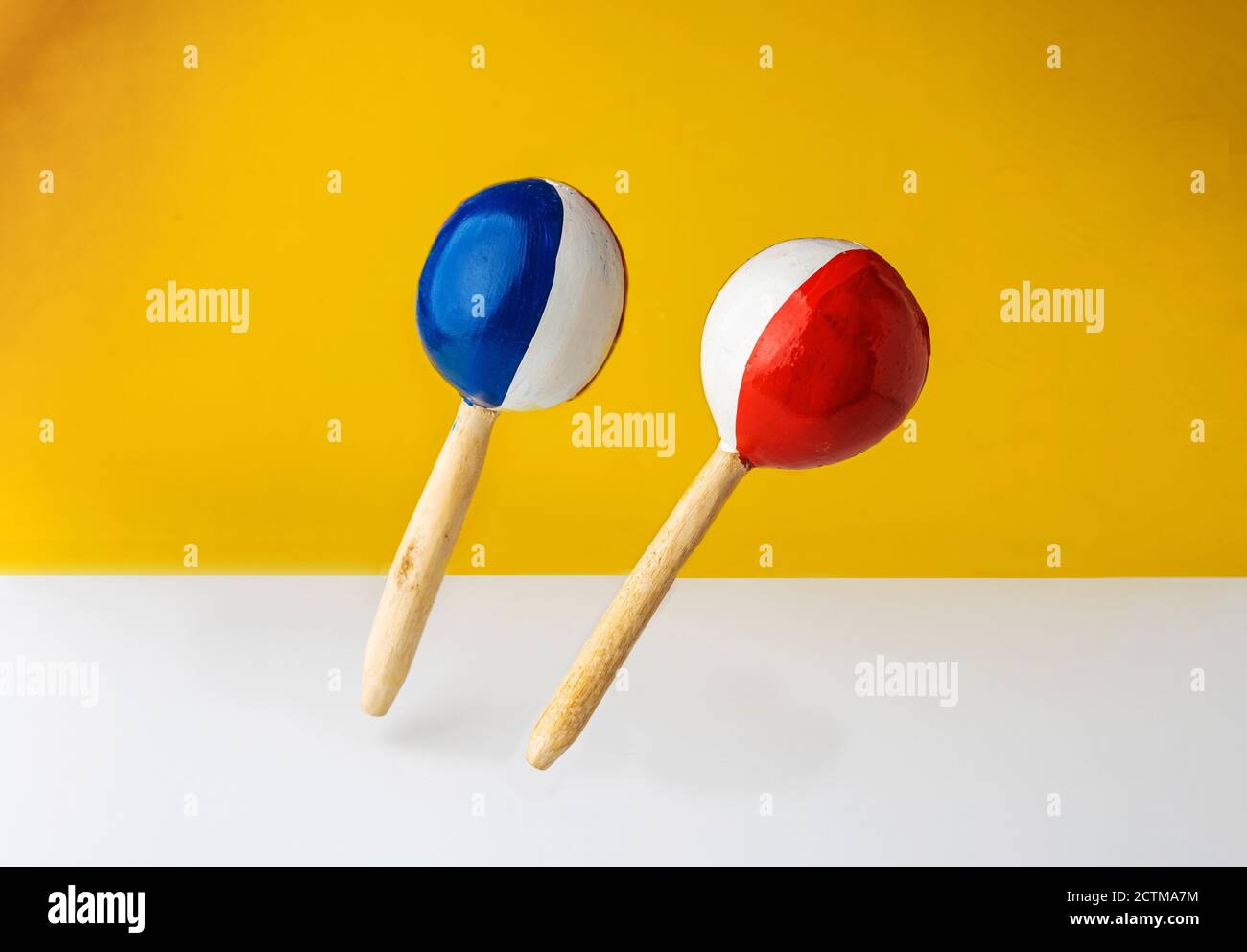 Closeup shot of colorful wooden maracas in the color background Stock ...