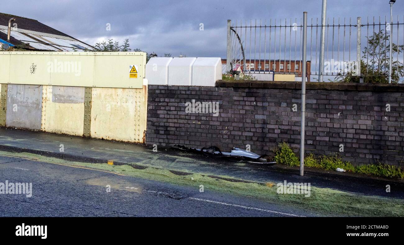 Car parts are pushed to the side of Frederick Road in Salford, Greater ...