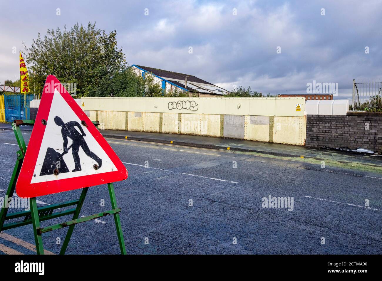 Car parts (right) are pushed to the side of Frederick Road in Salford ...
