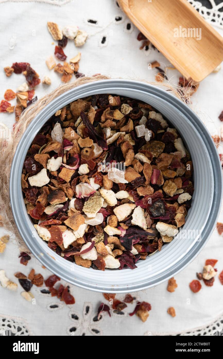 black tea flavored lychee, raspberry and rose on a rustic background ...