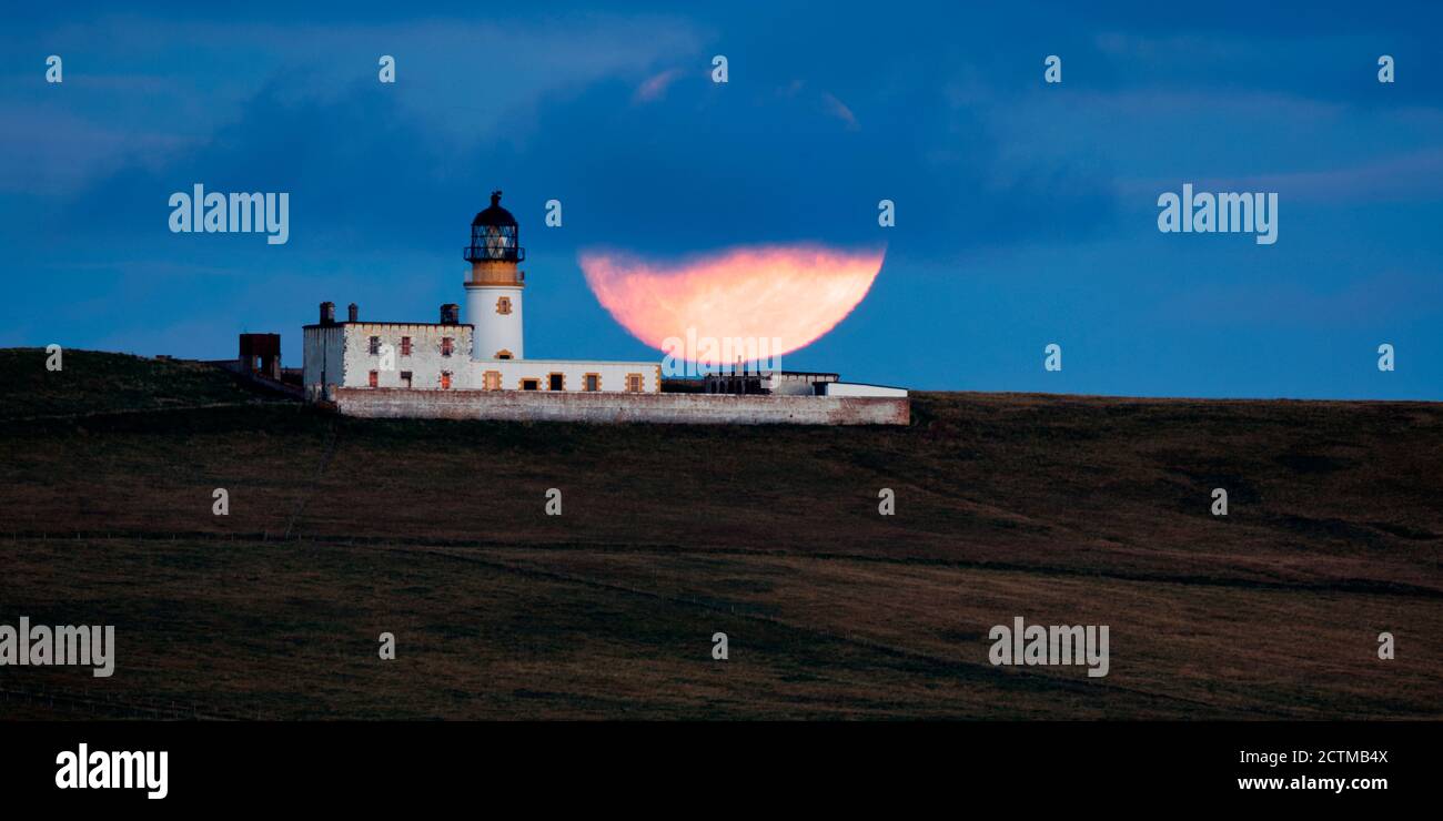 Copinsay lighthouse with partial full moon, Orkney Isles Stock Photo ...