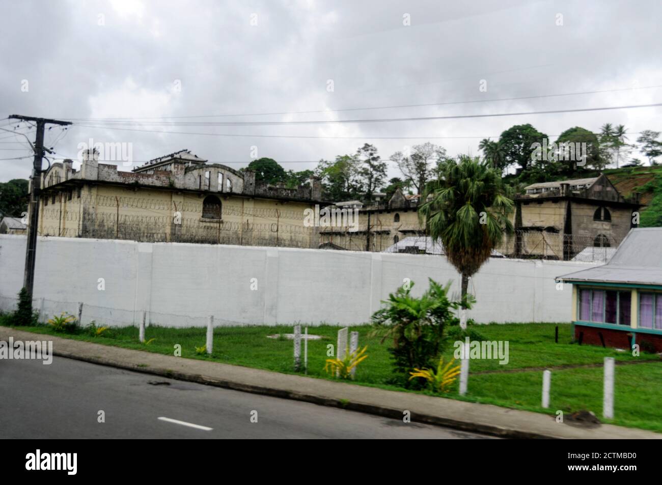The men's prison with barbed wire along its walls in Suva, Fiji in the ...