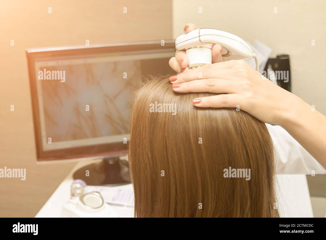 Woman check head hair in clinic Stock Photo - Alamy