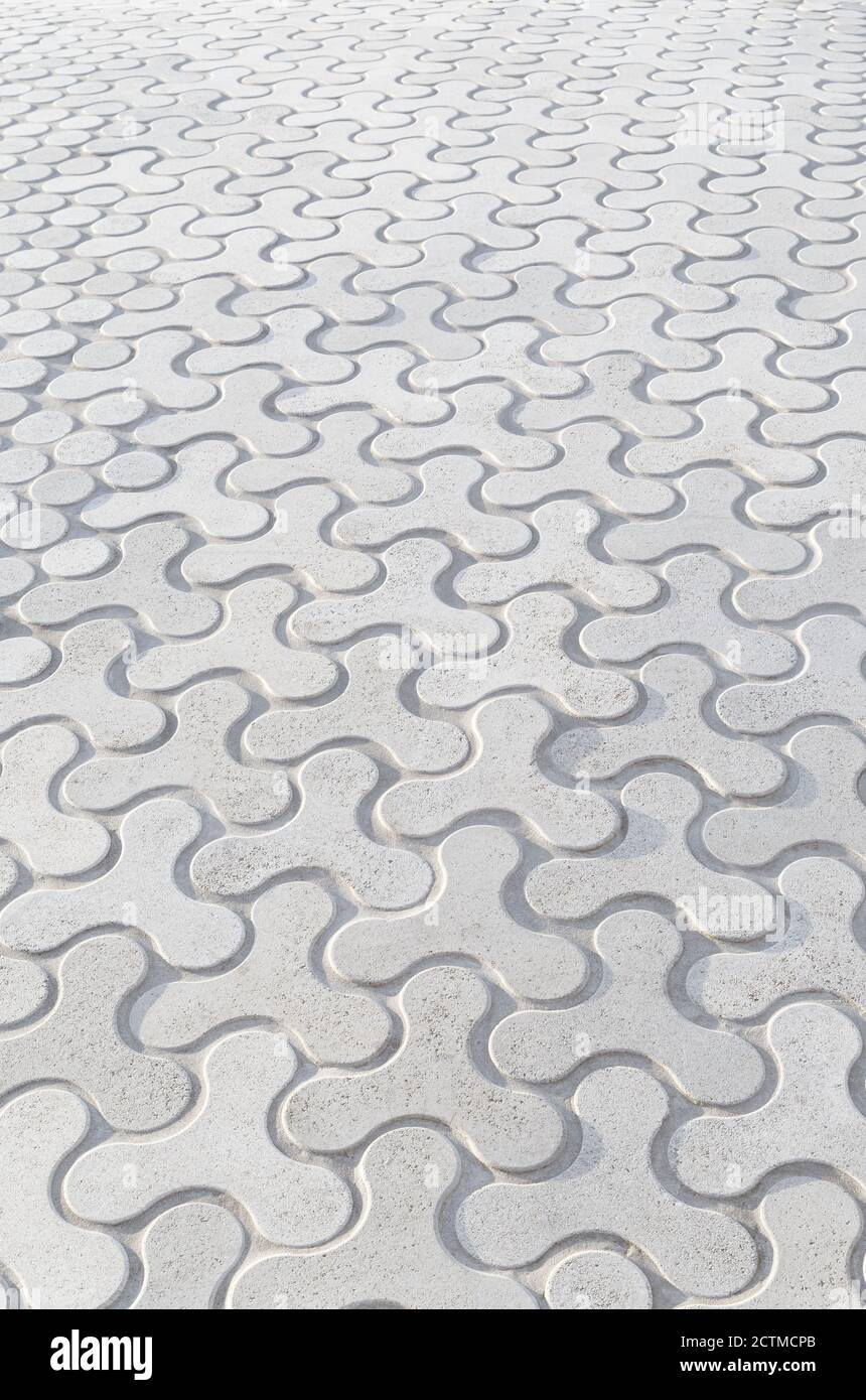 Abstract geometric white stone slab pattern on a sunny day. High ...