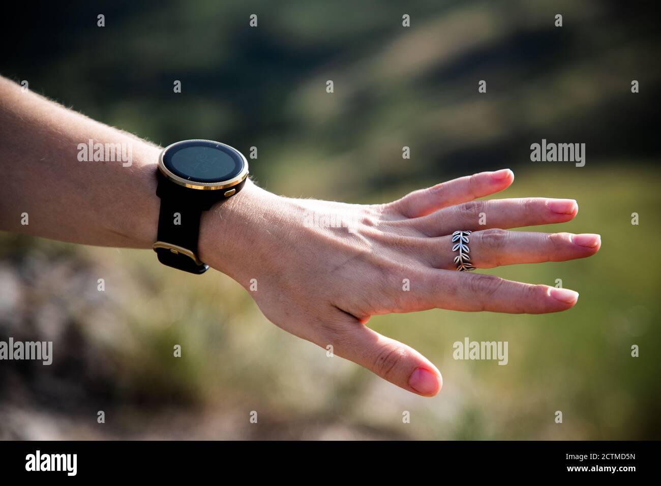 woman wearing a smart watch Stock Photo - Alamy