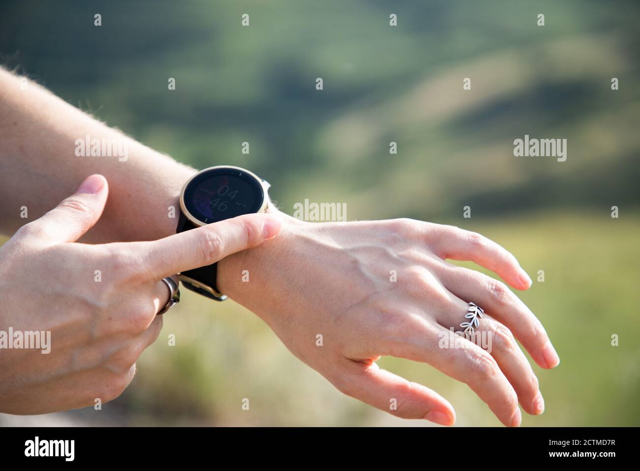 woman wearing a smart watch Stock Photo - Alamy