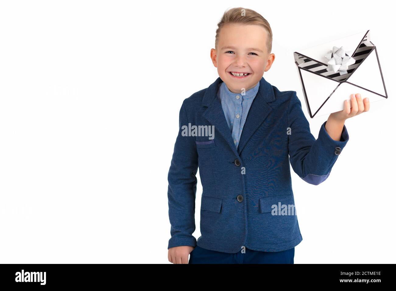 HAPPY LITTLE SMILING BOY LOOKING FORWARD AND LAUGHING BY OPENING THE ...
