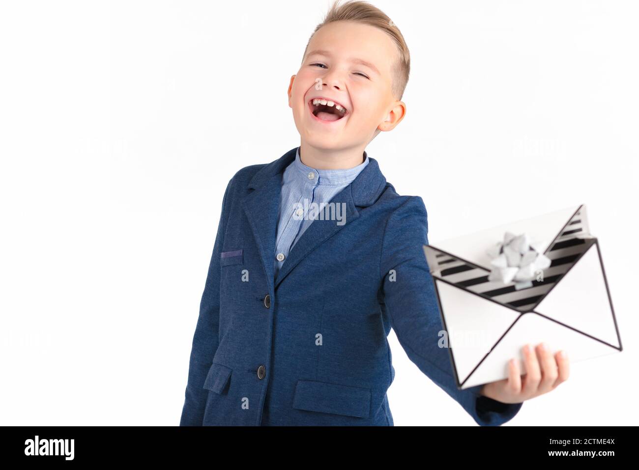 HAPPY LITTLE SMILING BOY LOOKING FORWARD AND LAUGHING BY OPENING THE ...