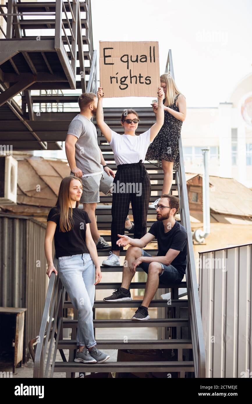 Equall rights. Dude with sign - woman stands protesting things that ...