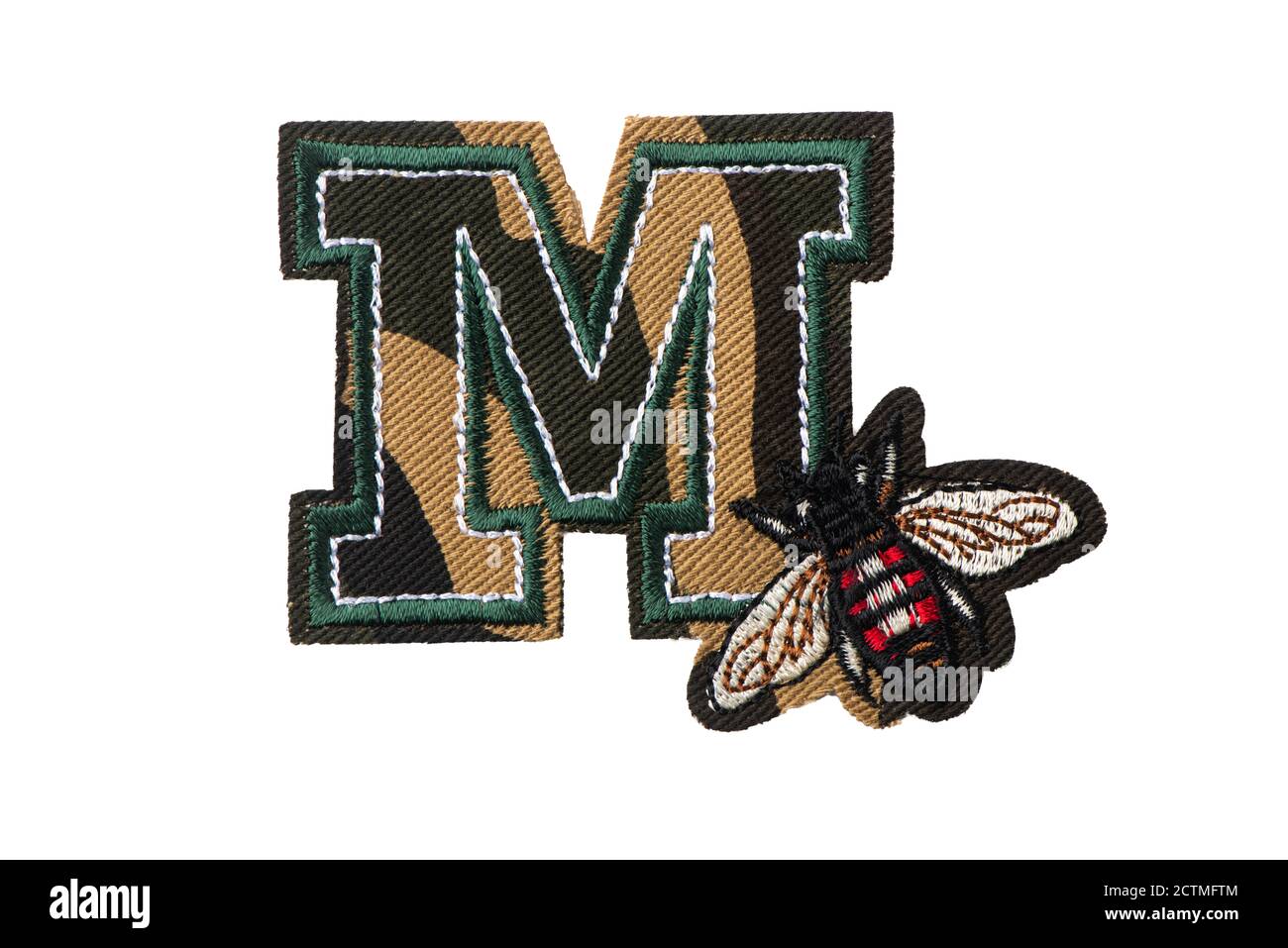 M letter with fly patch isolated on white background Stock Photo - Alamy