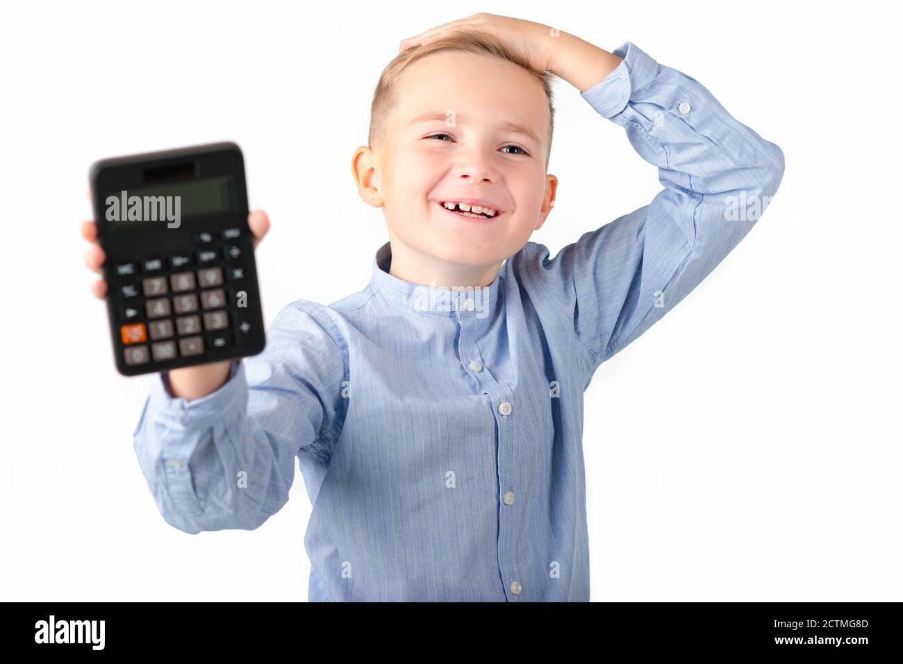 Schoolboy holding calculator. Portrait of funny cute 10s boy touching ...