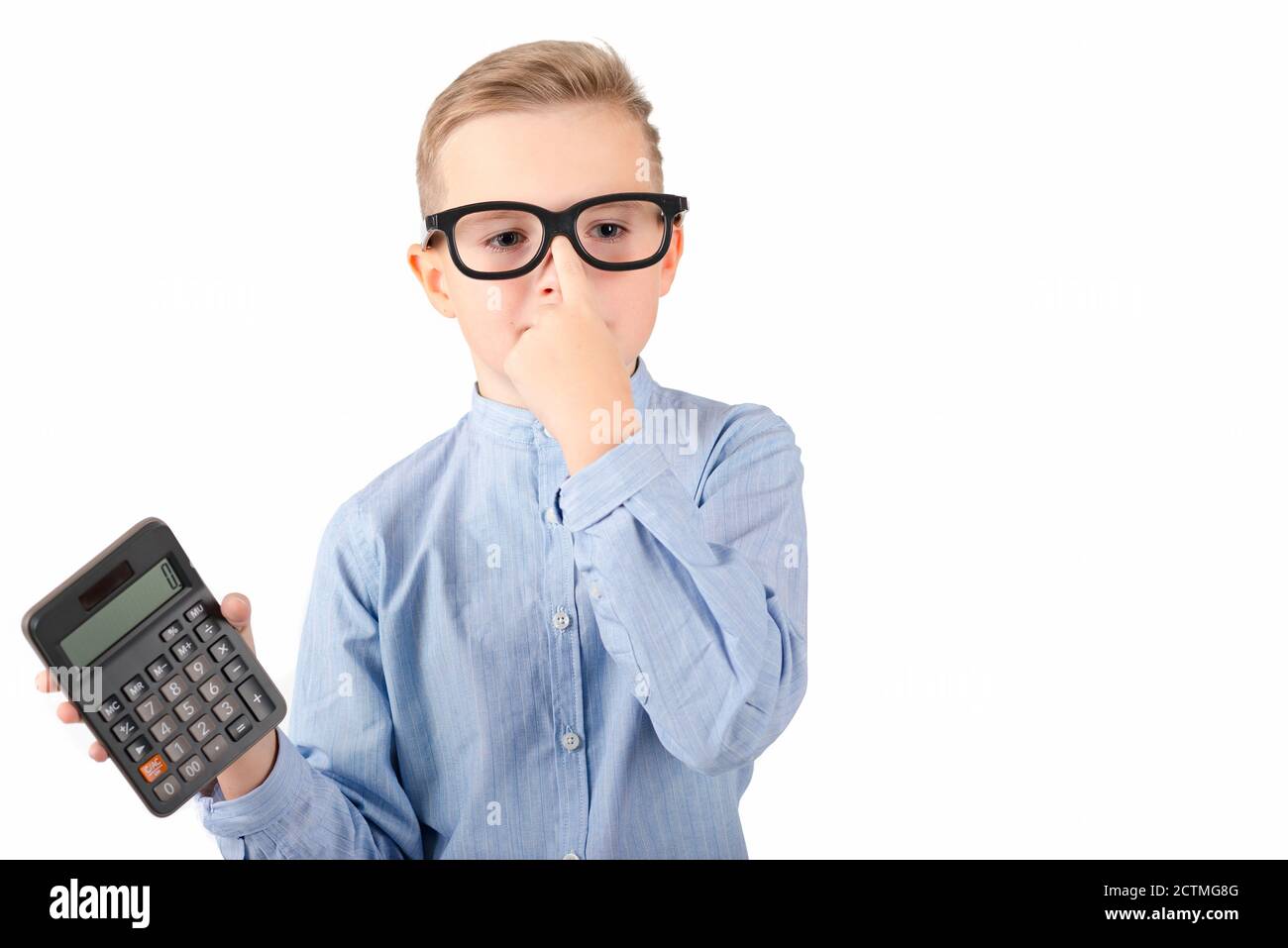 Nice child holding calculator. Portrait of funny cute schoolboy ...