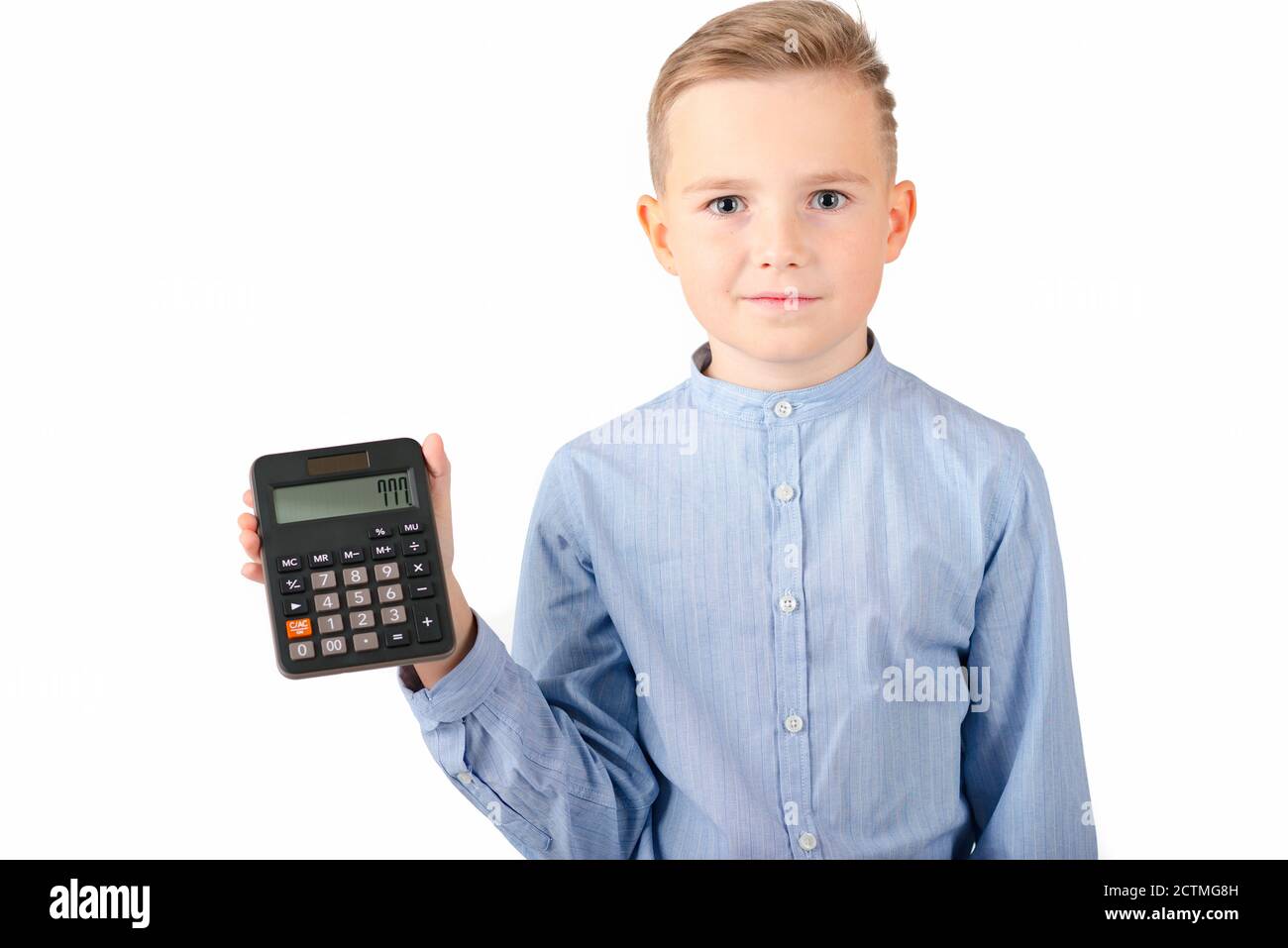 Calm Schoolboy holding calculator. Portrait of funny cute 10s boy ...