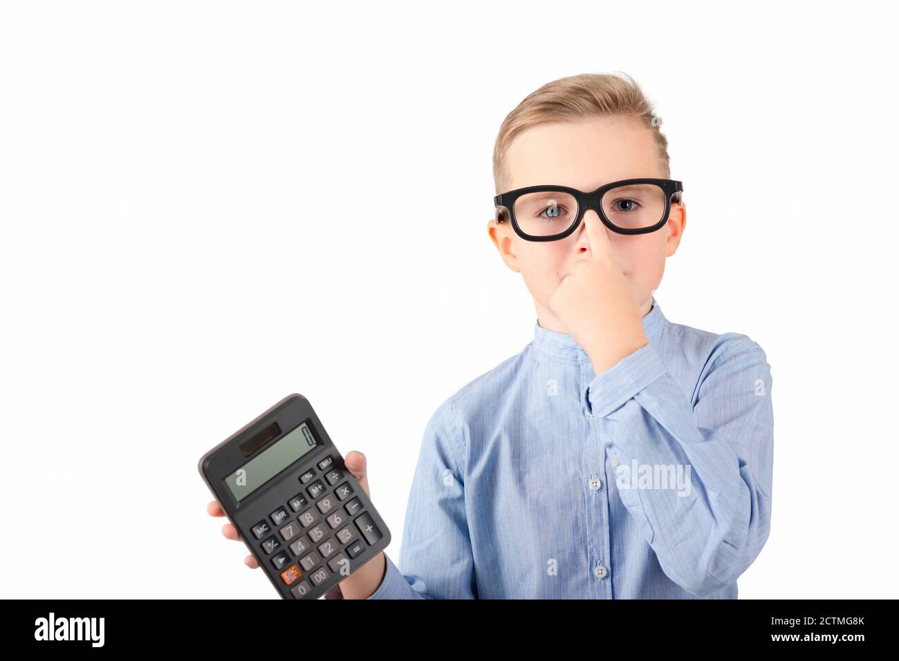 Nice child holding calculator. Portrait of funny cute schoolboy ...
