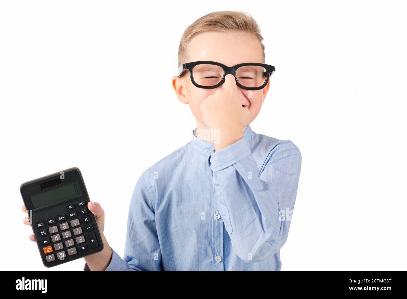 Nice child holding calculator. Portrait of funny cute schoolboy ...