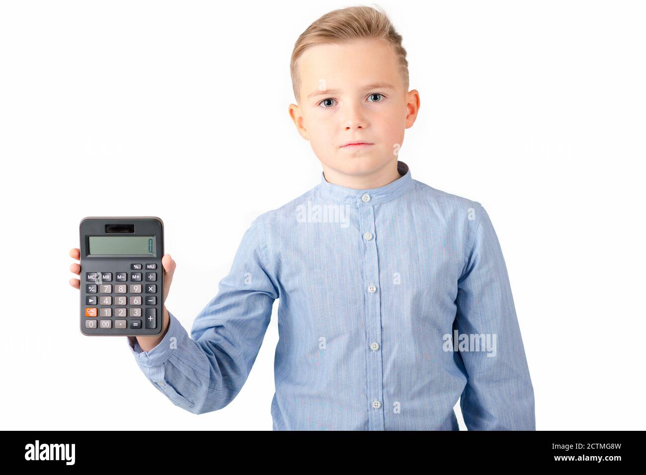 Schoolboy holding calculator. Portrait of funny cute 10s boy . tired ...