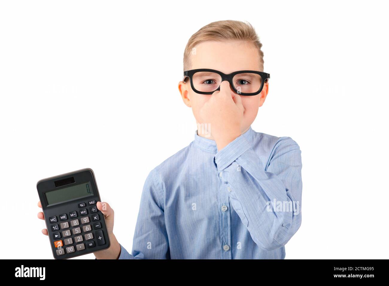 Nice child holding calculator. Portrait of funny cute schoolboy ...