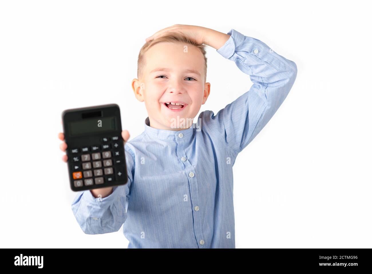 Schoolboy holding calculator. Portrait of funny cute 10s boy touching ...